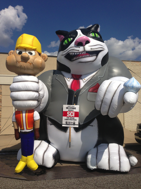 Striking SCI Funeral Directors Put Huge Inflatable Cat Outside Chicago ...